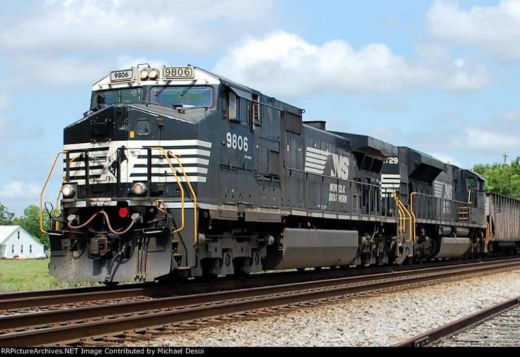 NS C40-9W #9806 leads a westbound empty hopper train across Maifield Ave.